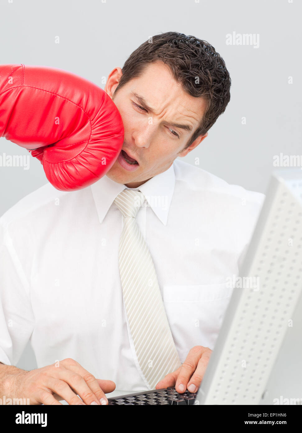 A businessman being boxed in his face Stock Photo - Alamy
