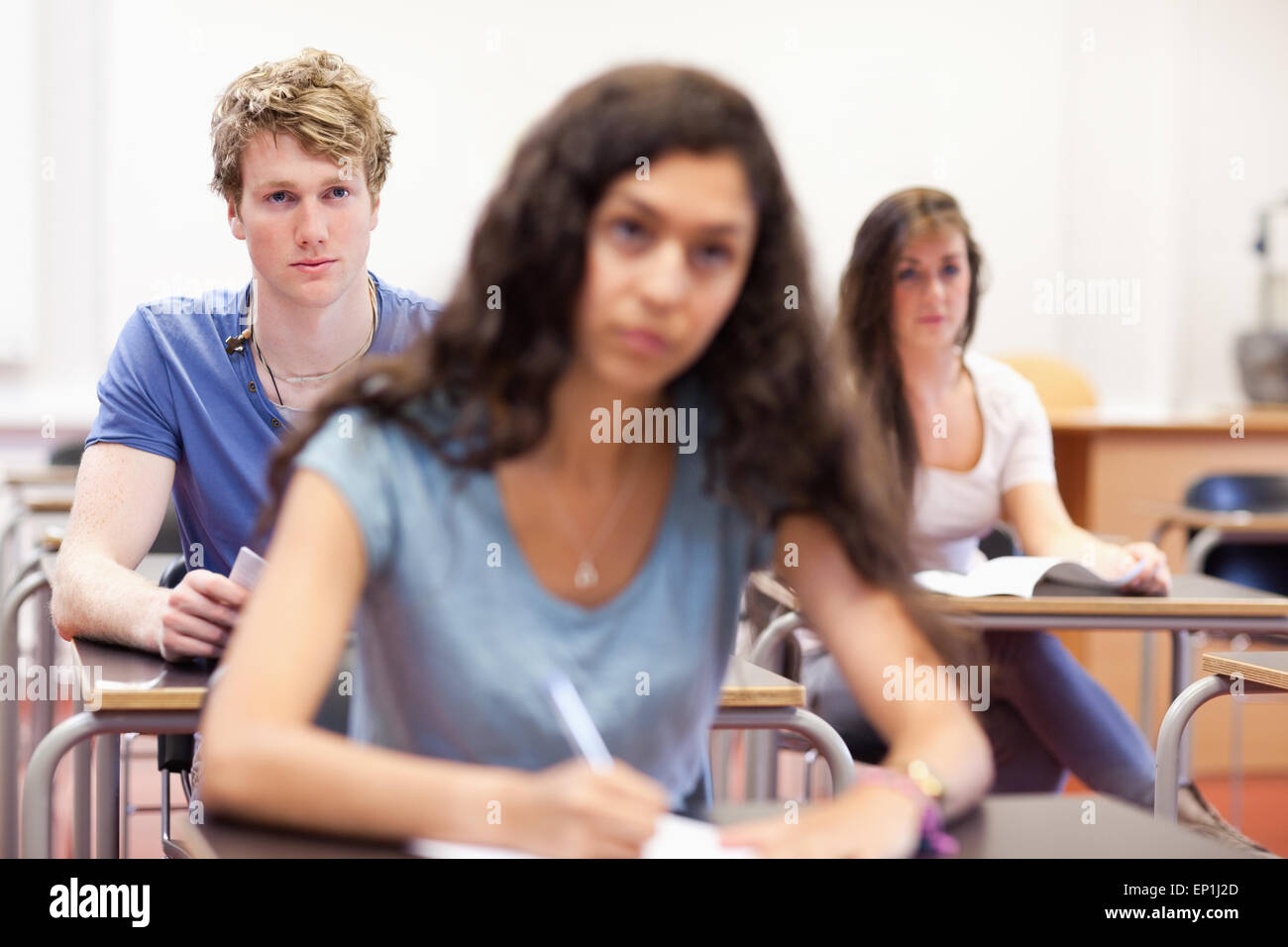 Focused students taking notes Stock Photo - Alamy