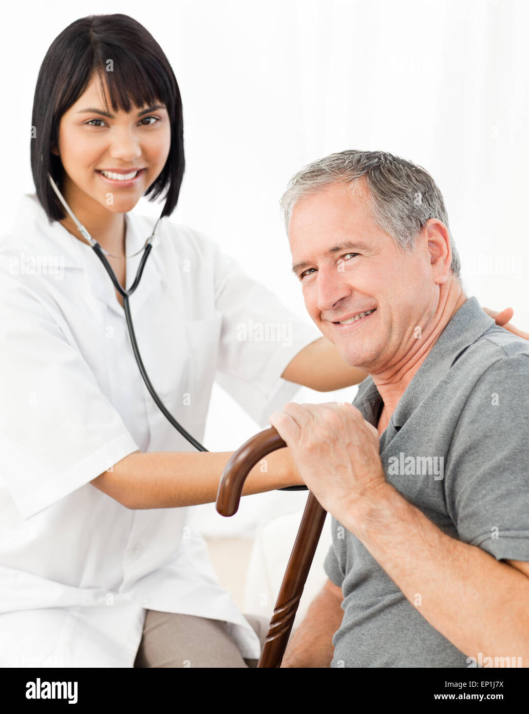 Nurse with her patient looking at the camera Stock Photo - Alamy