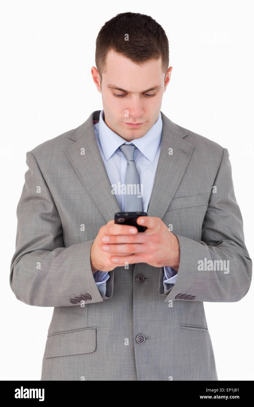 Close up of young businessman writing text message Stock Photo - Alamy