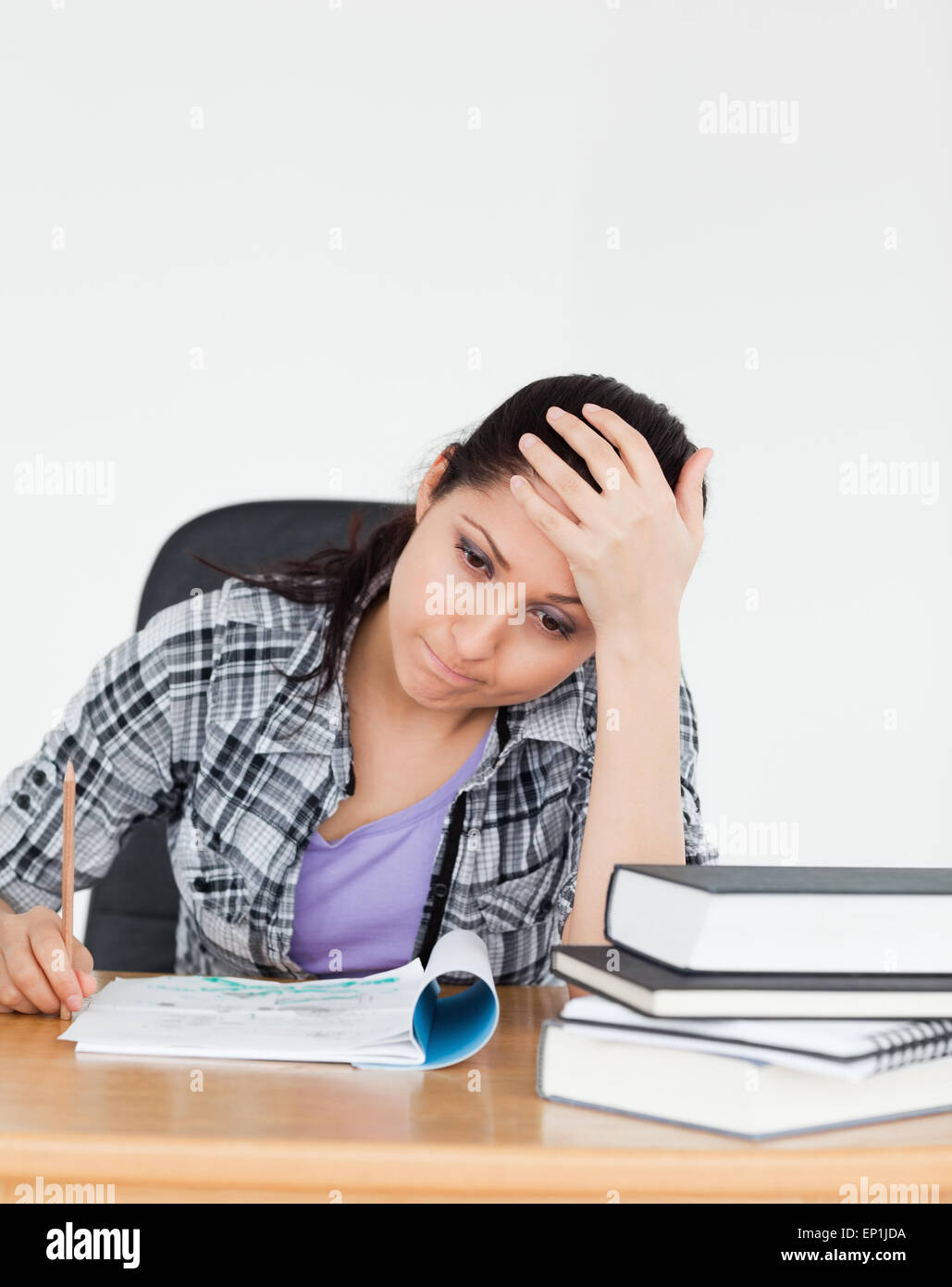 Frustrated young student with homework Stock Photo - Alamy