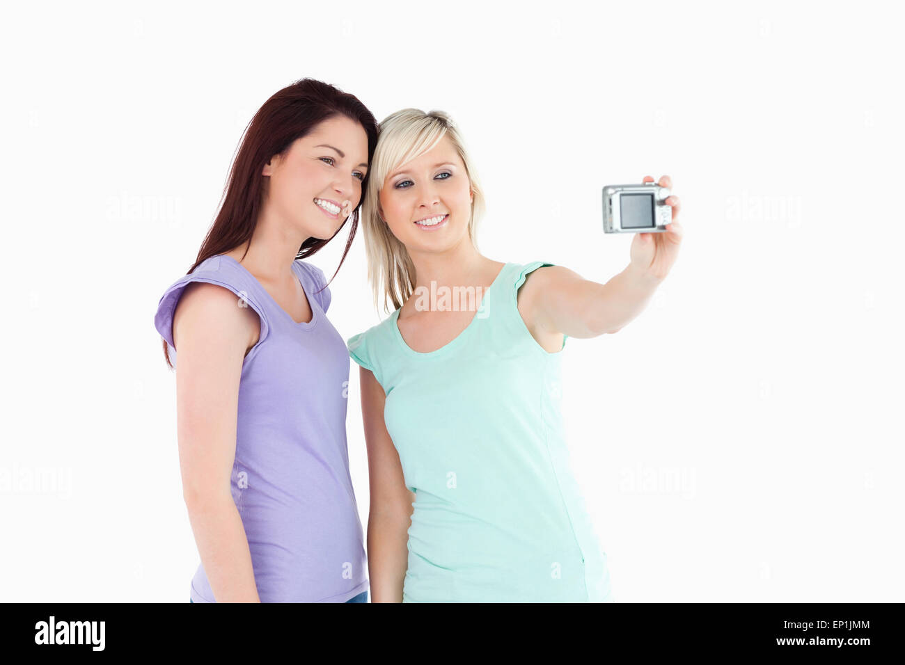 Cheerful women with a camera Stock Photo - Alamy