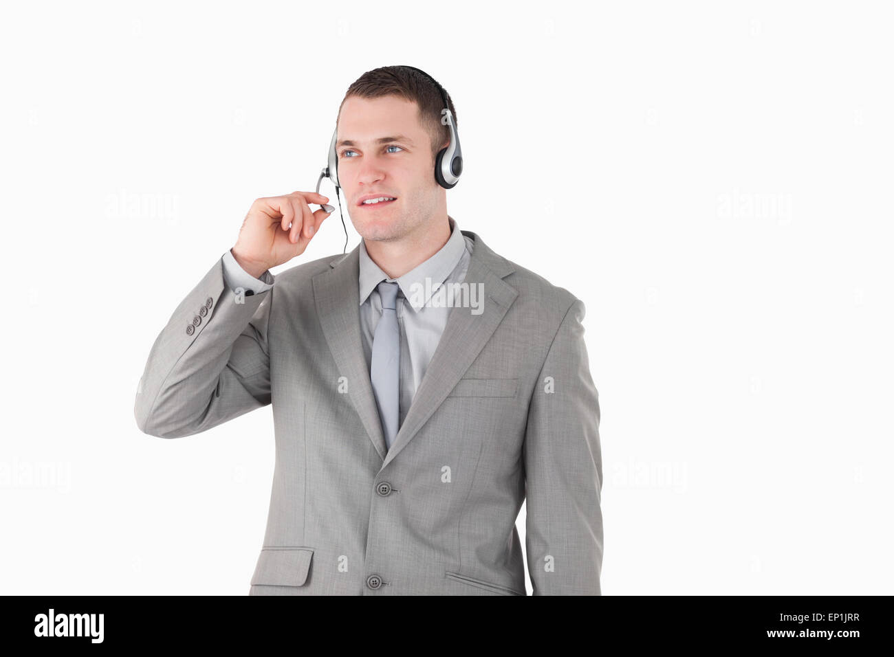 Businessman using a headset Stock Photo - Alamy