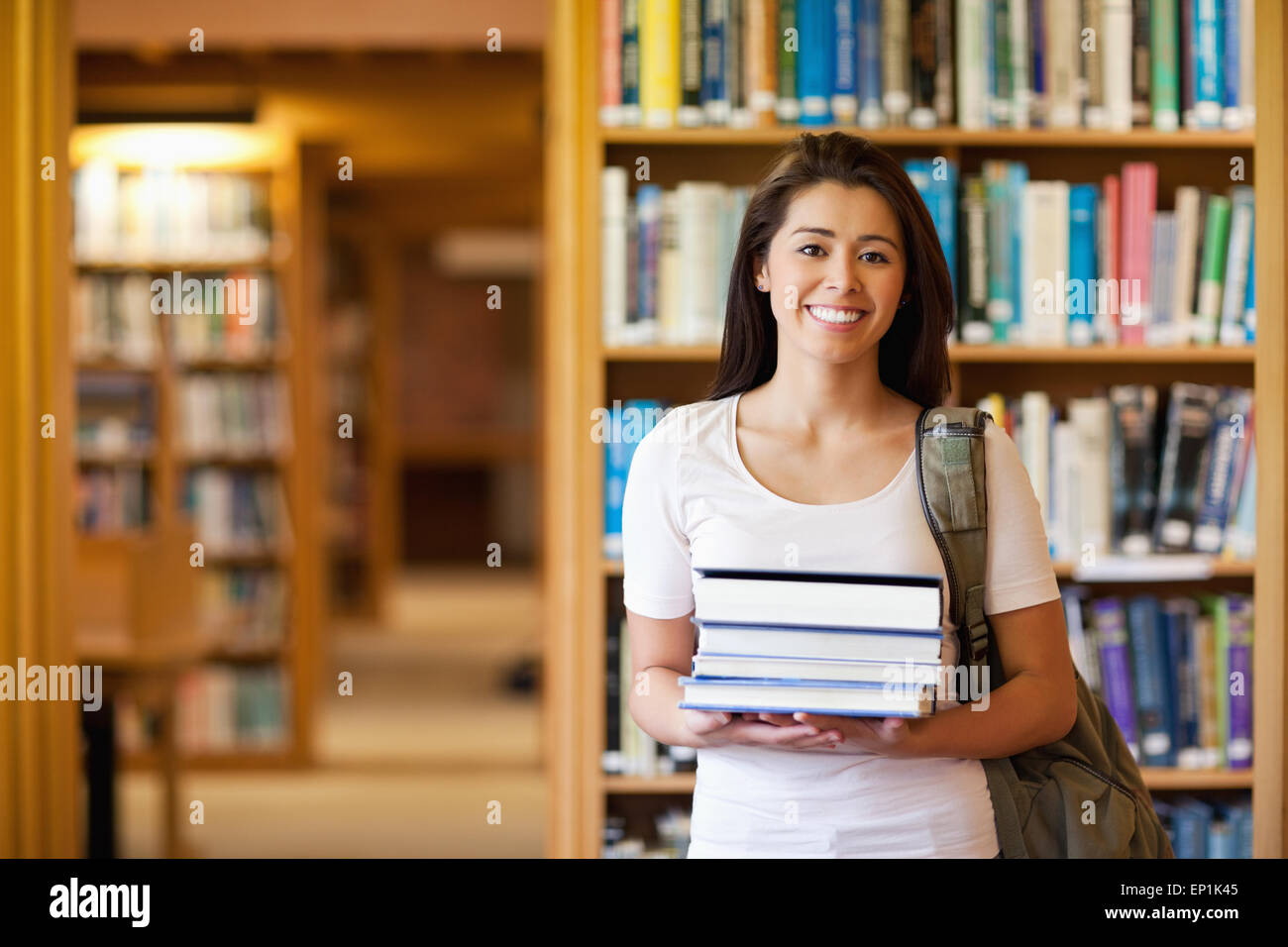 Student holding books Stock Photo - Alamy