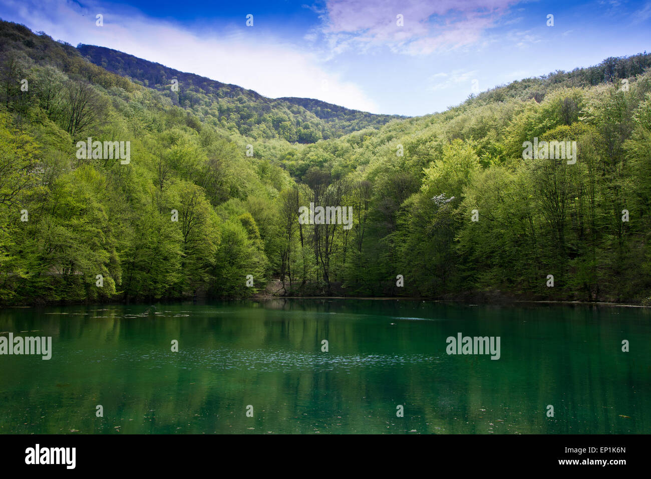 Beautiful emerald mountain lake in Beech Mountains, Szilvasvarad ...