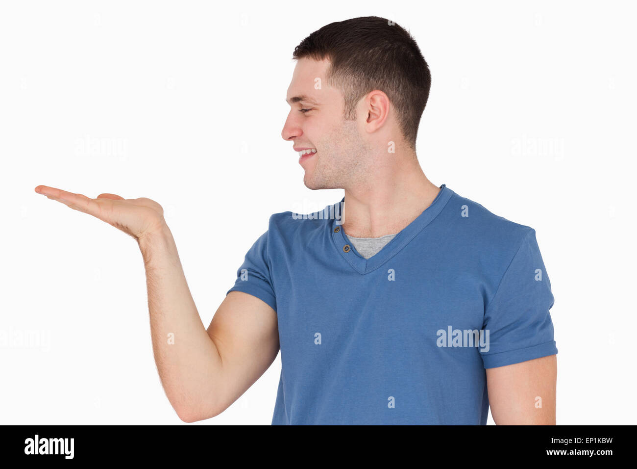 Man holding something Stock Photo - Alamy