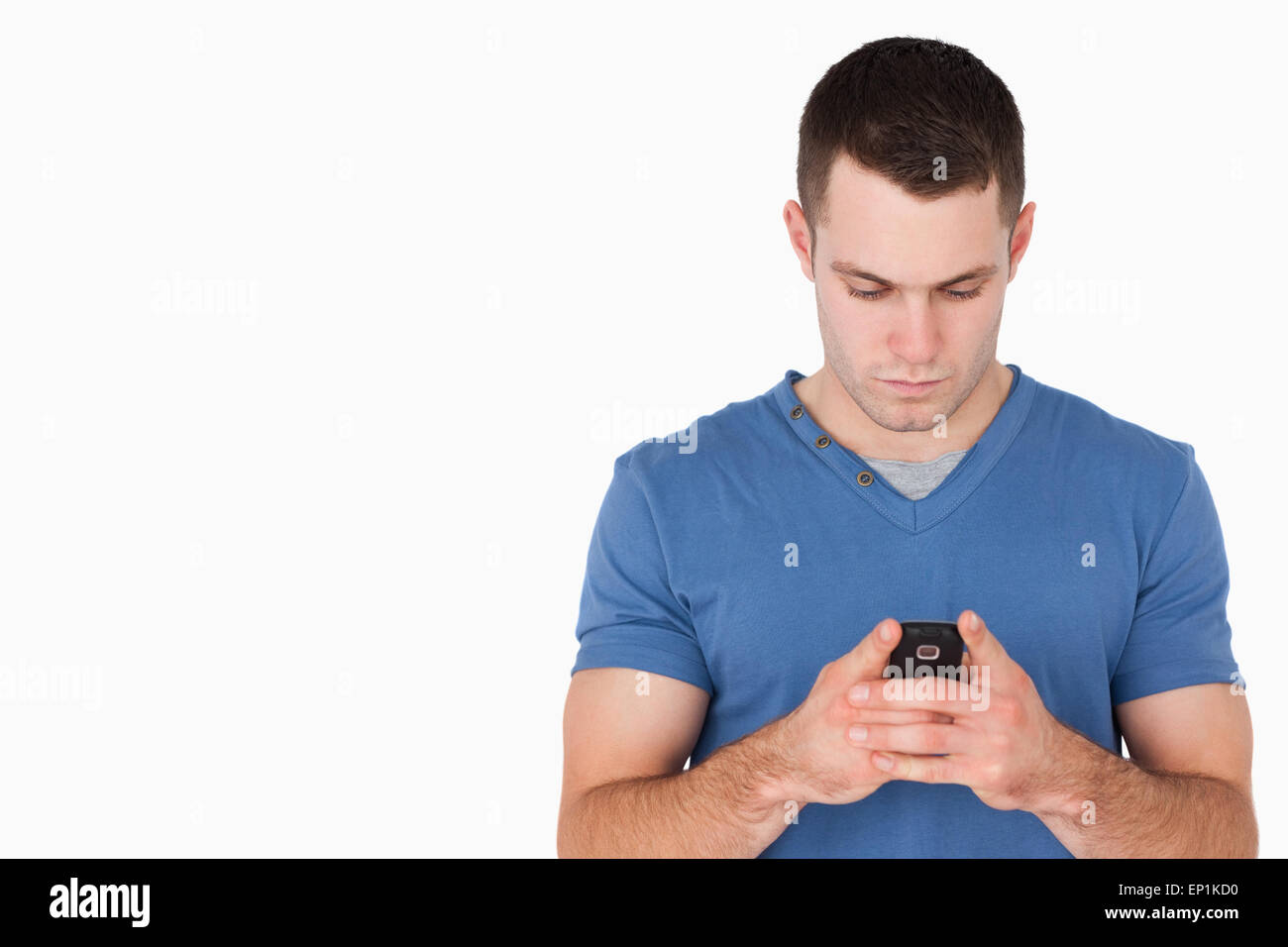 Young man sending text messages Stock Photo - Alamy Young man sending text messages Stock Photo - Alamy