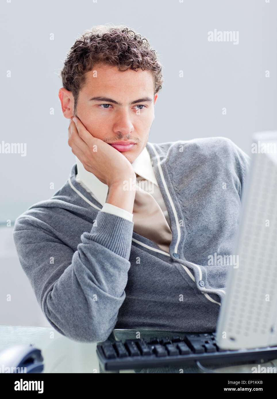 Bored businessman at his desk Stock Photo - Alamy