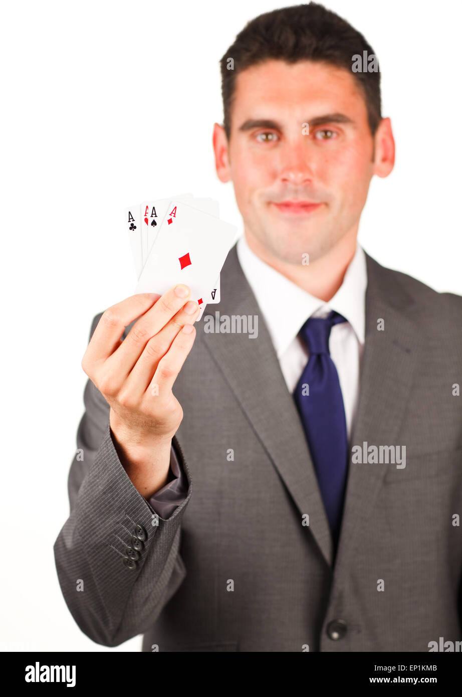 Businessman showing four aces poker cards Stock Photo - Alamy