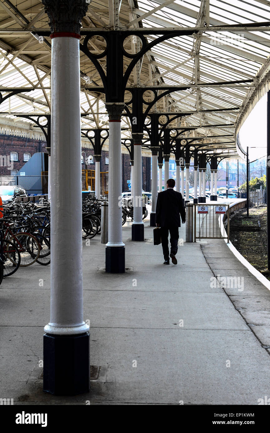 Commuter on York City train station platform Stock Photo - Alamy