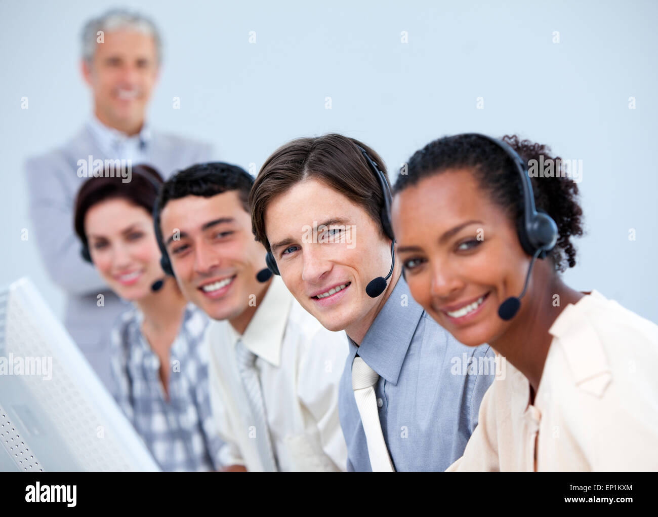 Positive business people working in a call center Stock Photo - Alamy