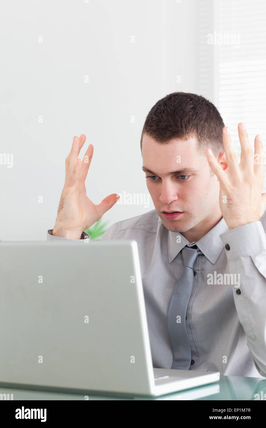 Close up of young businessman having problems with his laptop Stock ...