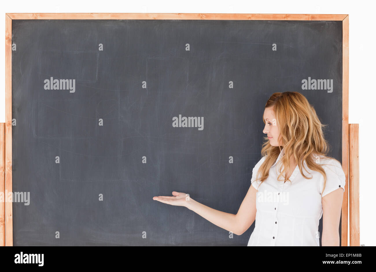 Female instructor showing blackboard hi-res stock photography and ...