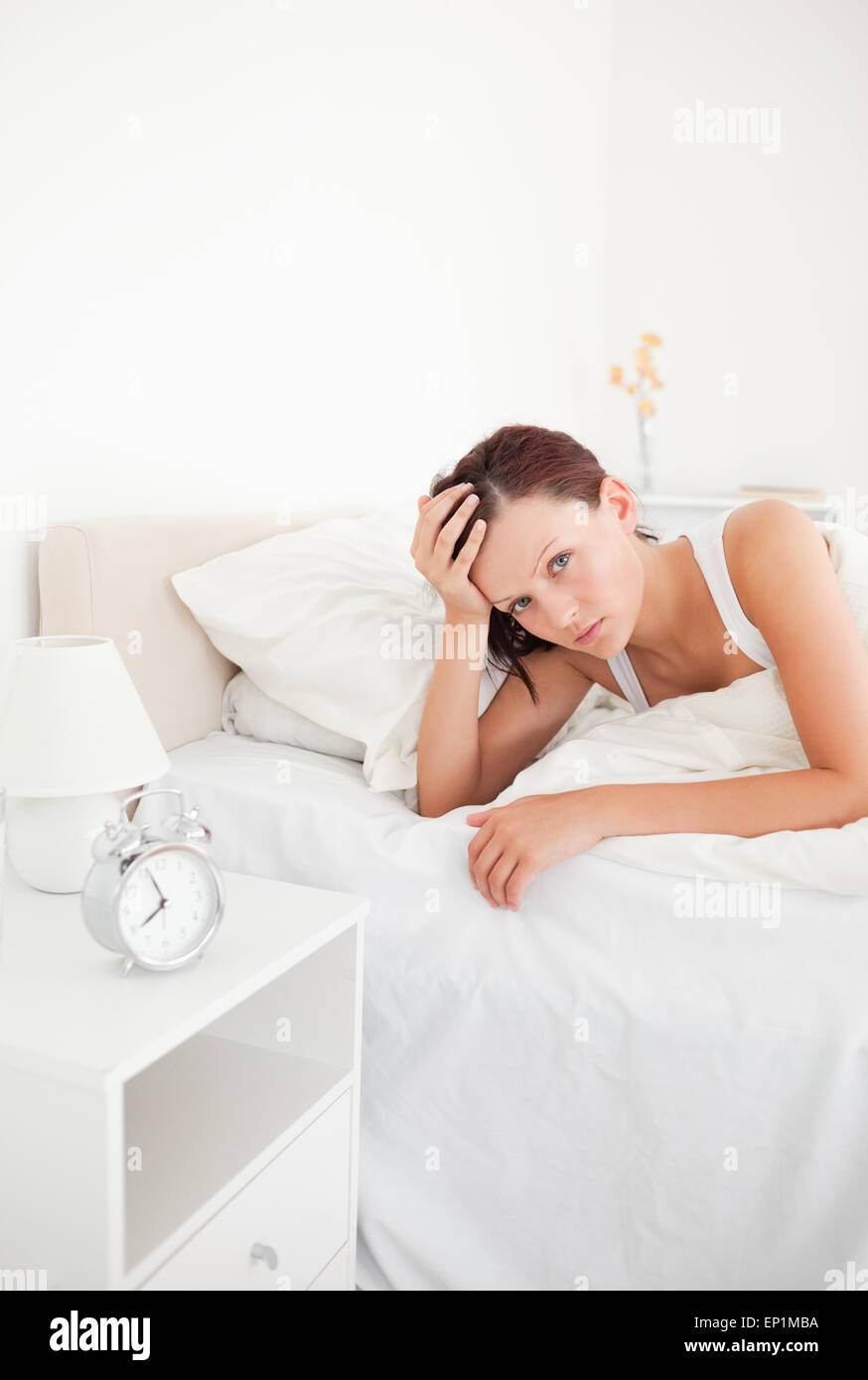 Cute red-haired woman waking up looking into the camera Stock Photo - Alamy