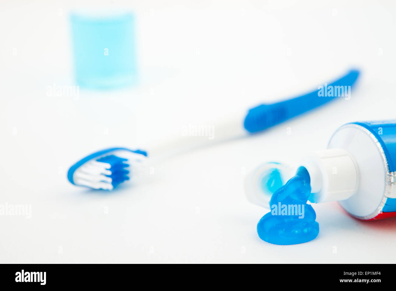 Close up of a toothbrush next to a tube of toothpaste Stock Photo - Alamy