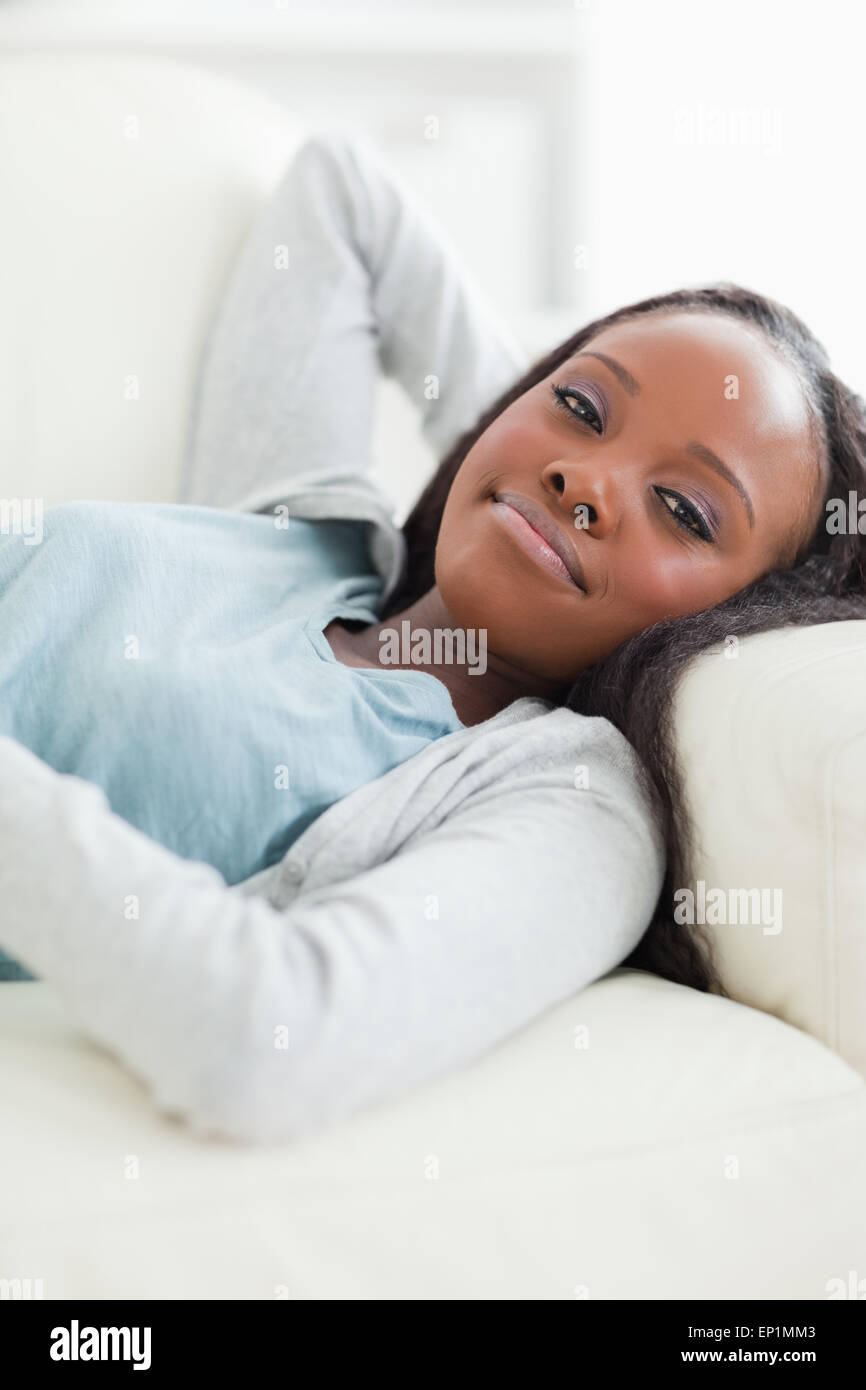 Close up of happy woman taking a rest on the sofa Stock Photo - Alamy