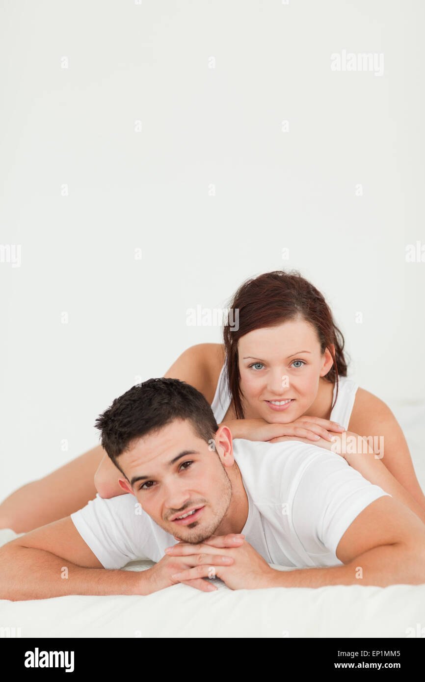Portrait of a Beautiful Woman lying on her man Stock Photo - Alamy