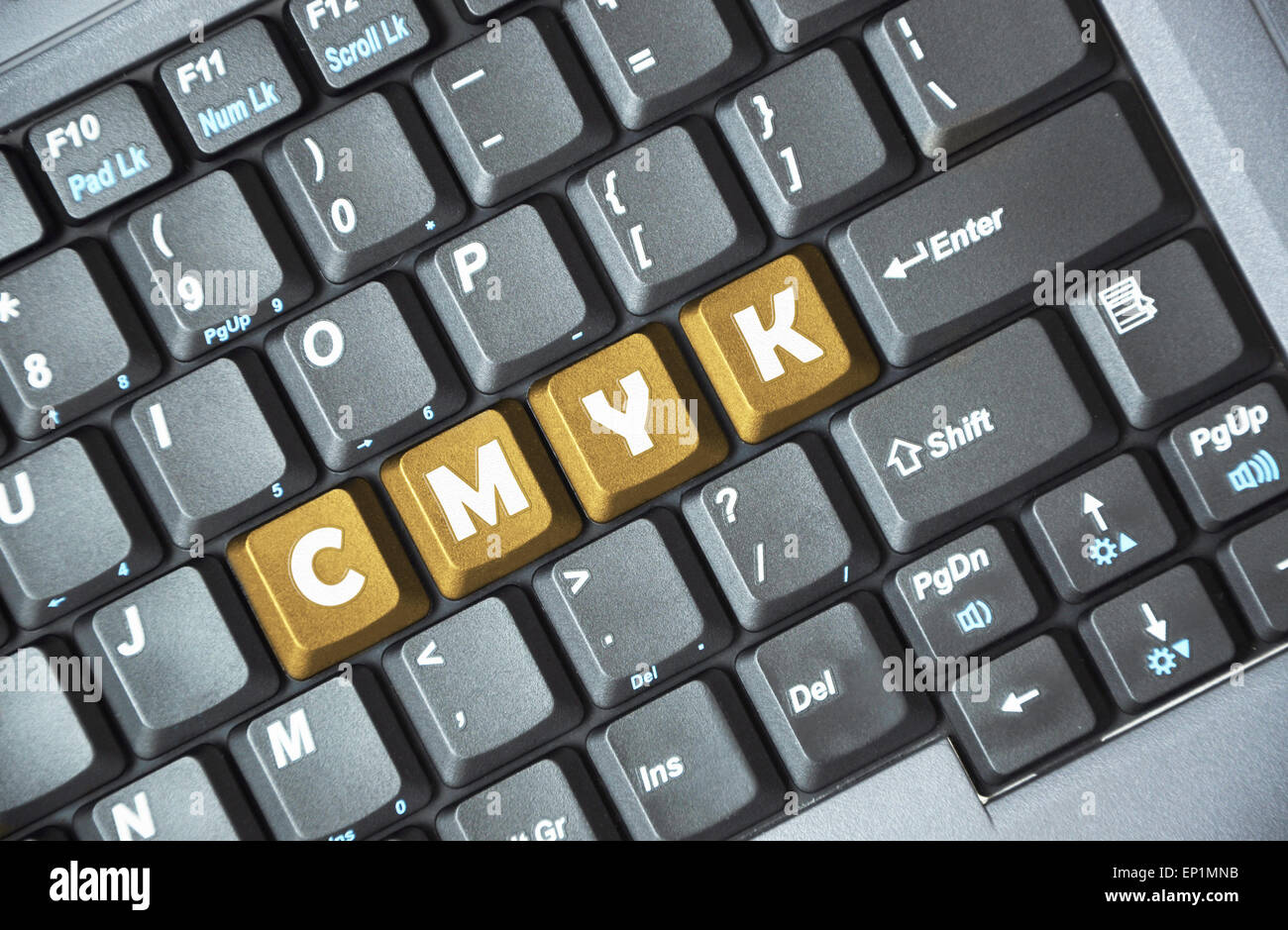 Brown cmyk key on keyboard Stock Photo - Alamy