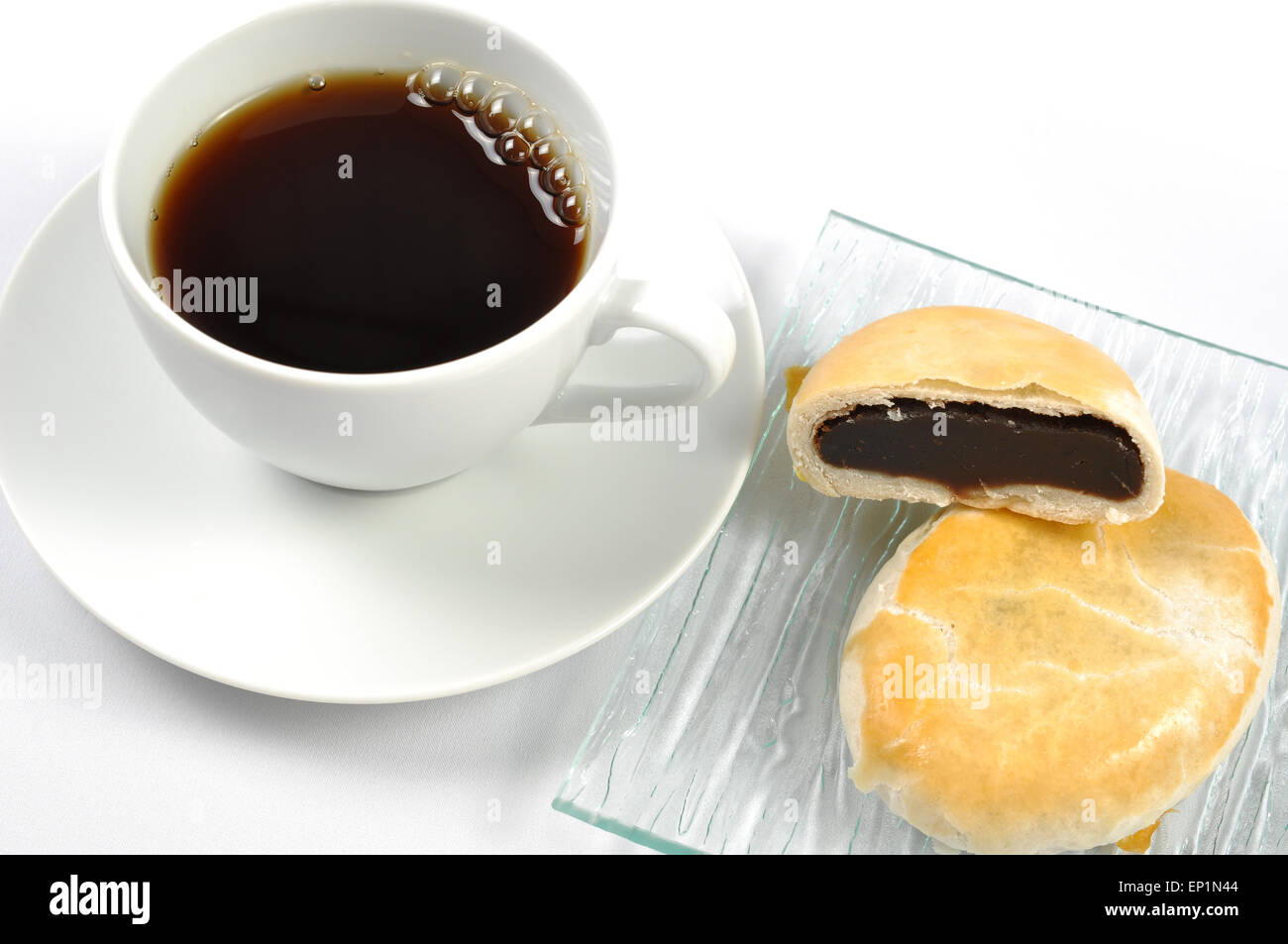 Hot coffee with sweet snack on white background Stock Photo - Alamy