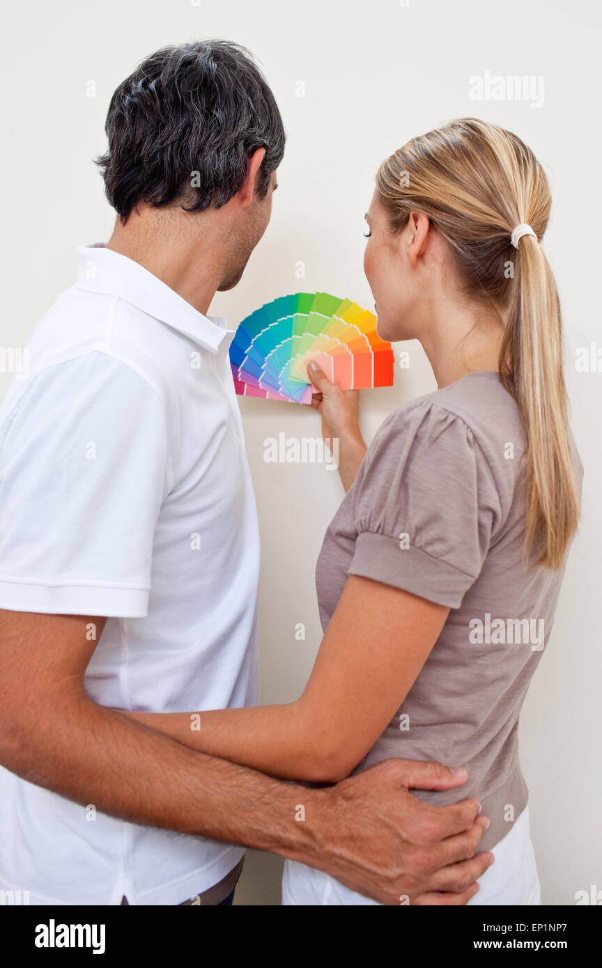 Happy Couple choosing a color with to paint their bedroom Stock Photo ...