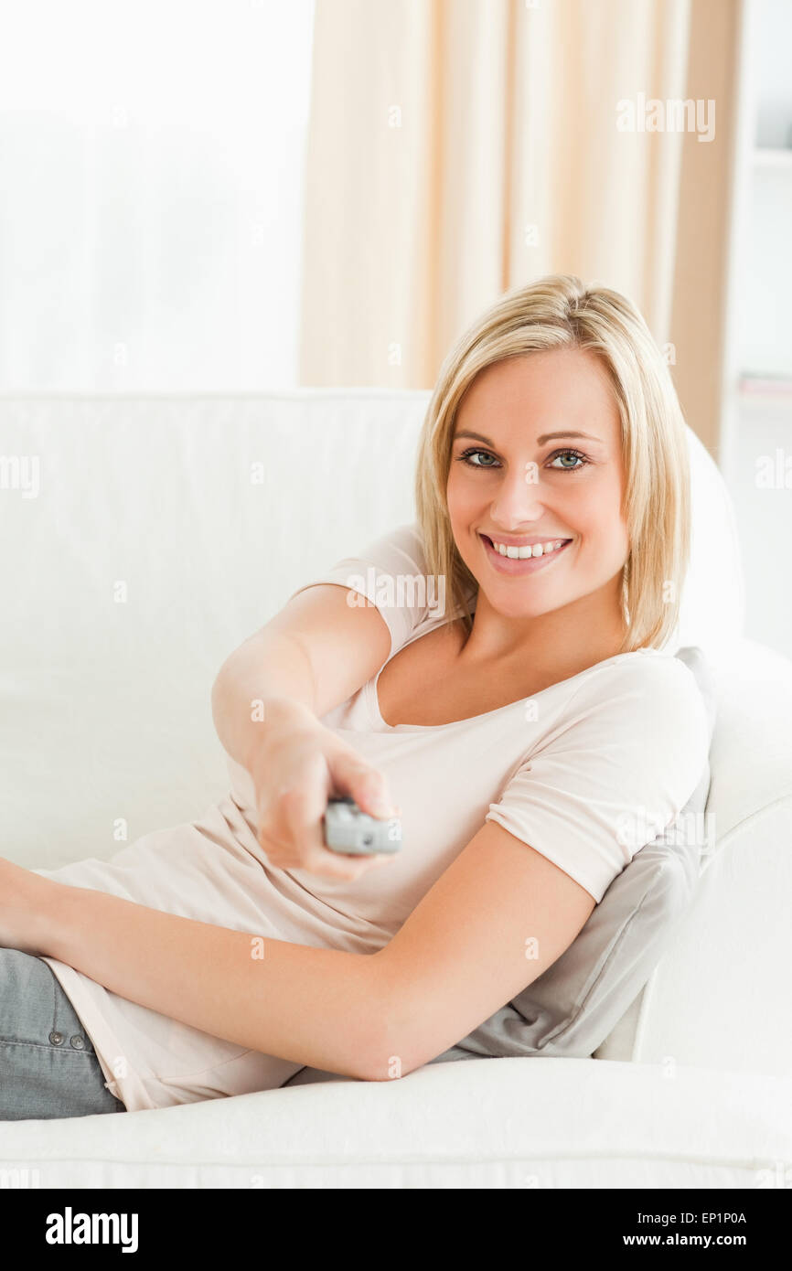 Woman and pointing remote control hi-res stock photography and images ...
