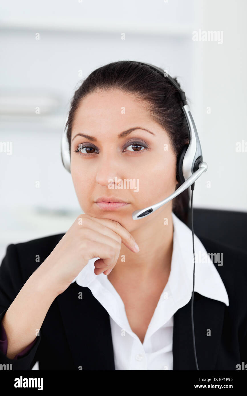 Thoughtful young operator in office Stock Photo - Alamy