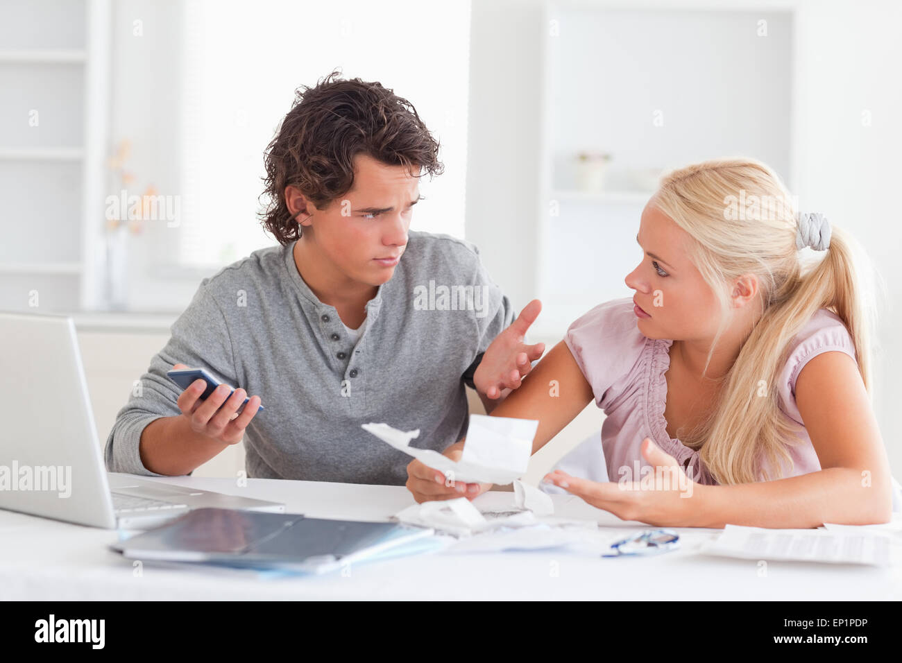 Clueless couple doing accounts Stock Photo - Alamy
