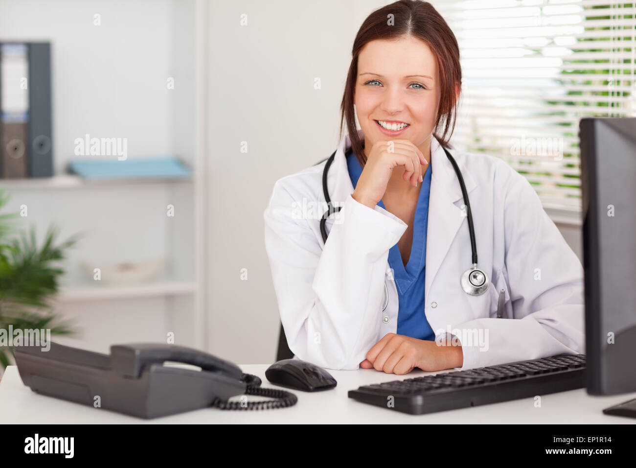 Kind female doctor in office Stock Photo - Alamy
