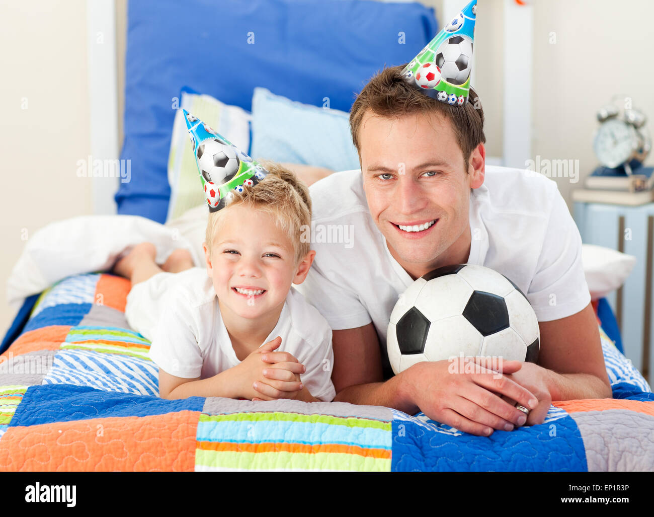 Happy child and his father playing with a soccer ball Stock Photo - Alamy