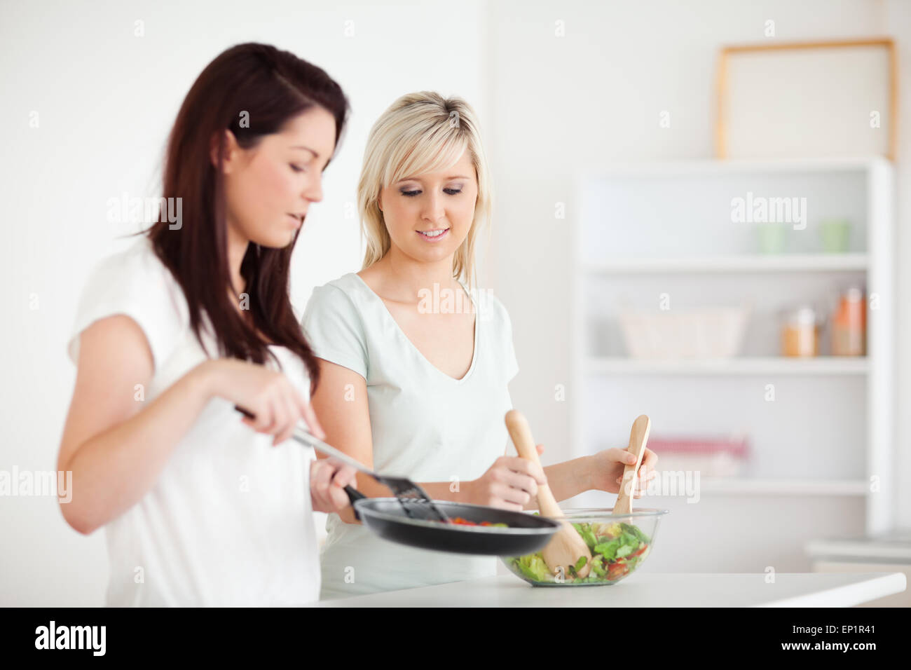 Beautiful Women cooking dinner Stock Photo - Alamy