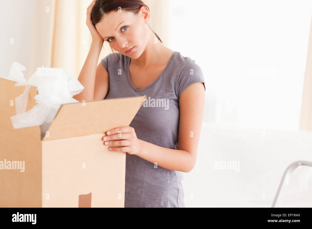 Woman with cardboard Stock Photo - Alamy