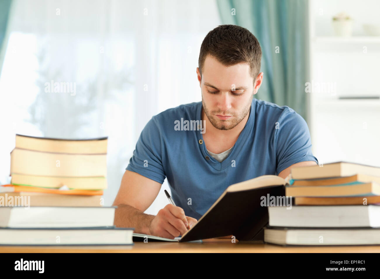 Student doing his homework Stock Photo - Alamy
