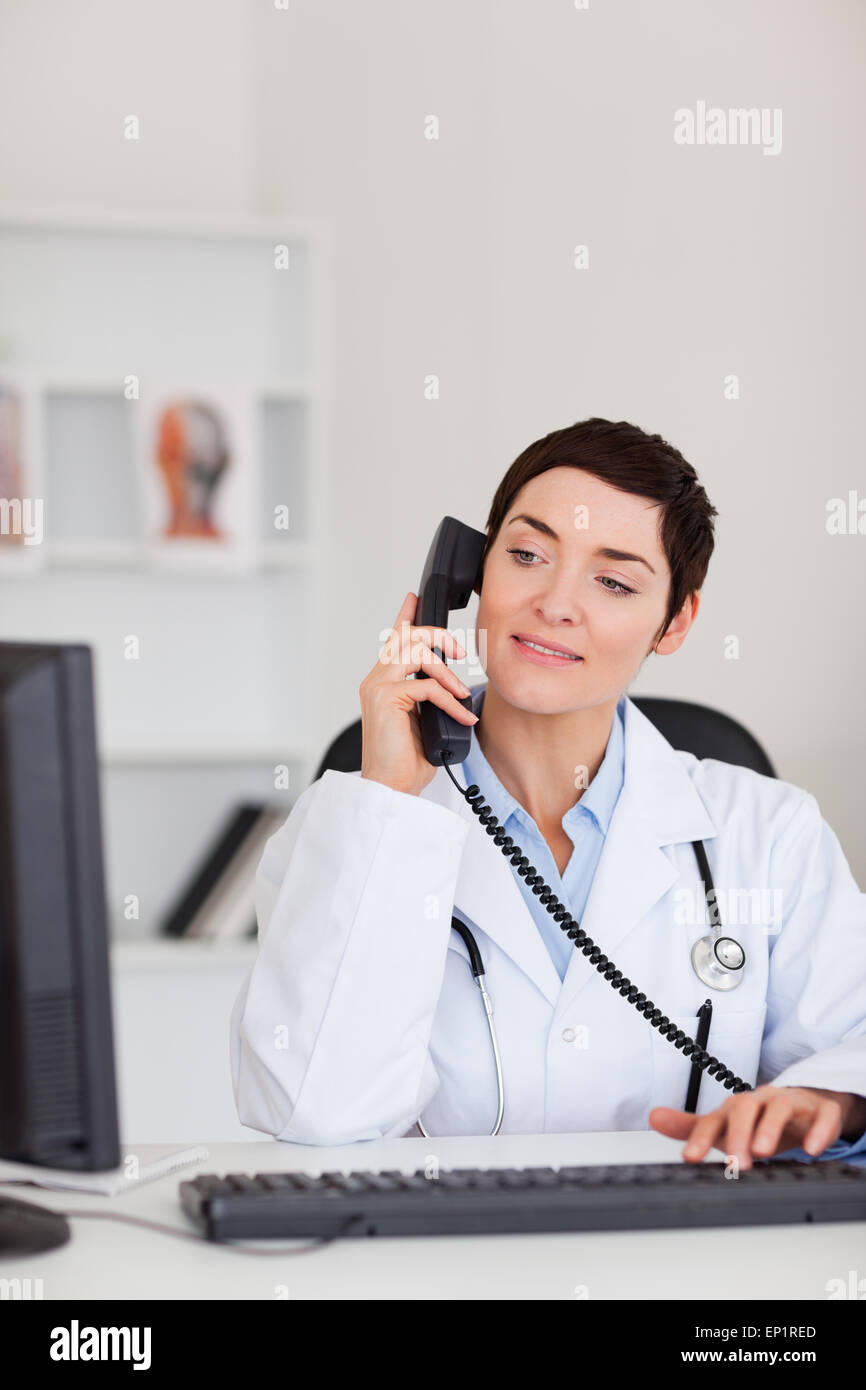 Portrait of a female doctor making a phone call Stock Photo - Alamy
