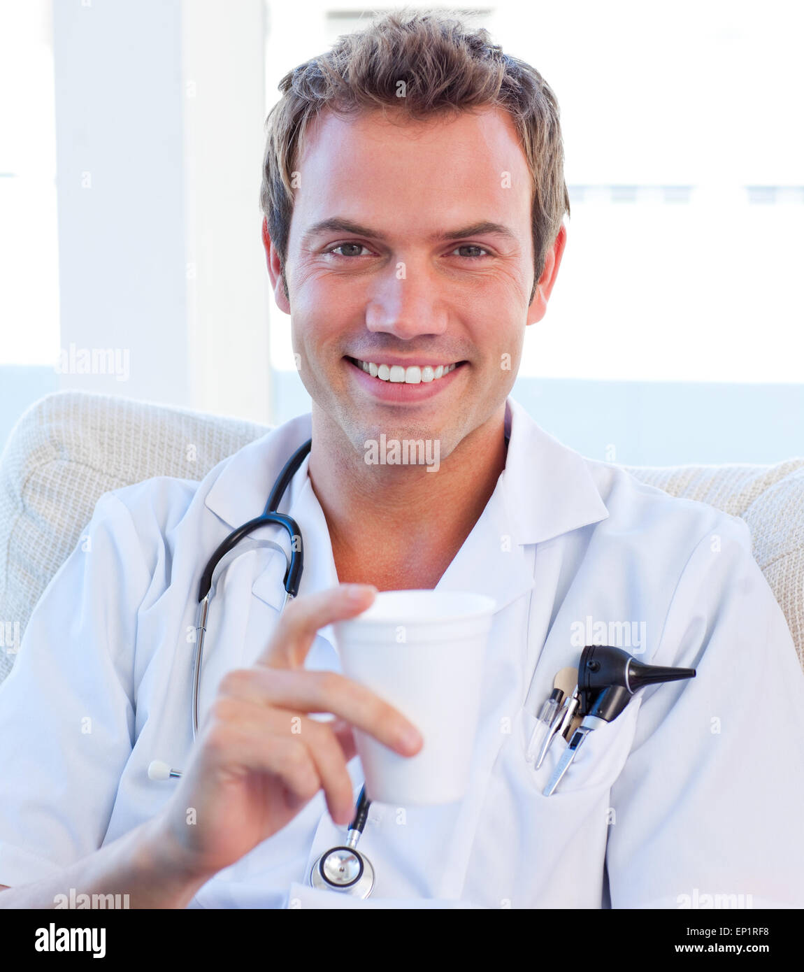 Positive doctor having a break Stock Photo - Alamy