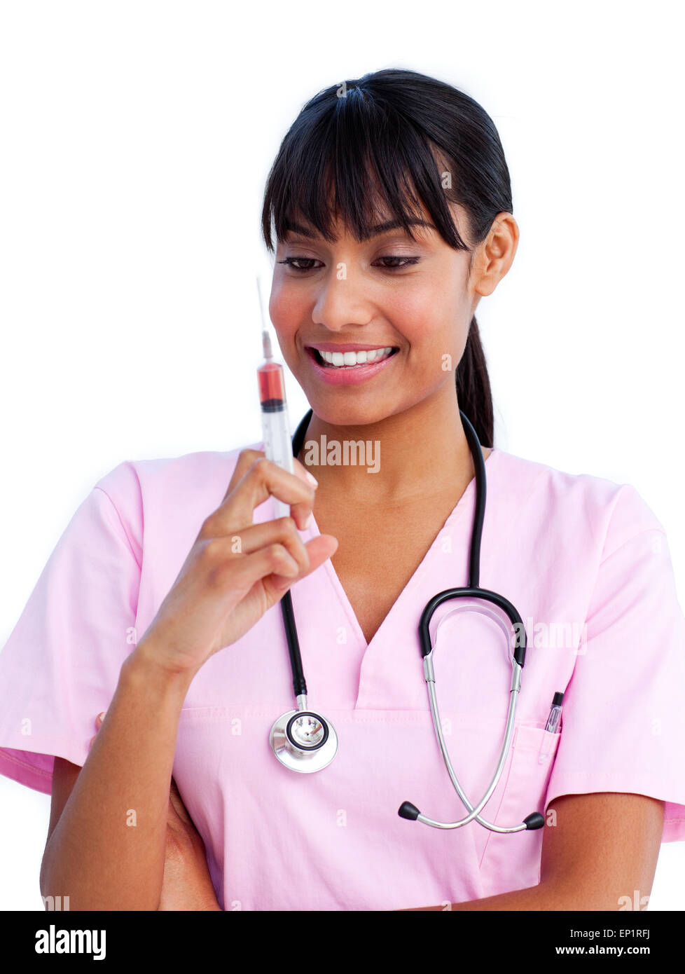 Portrait of a smiling female doctor holding a syringe against a white ...