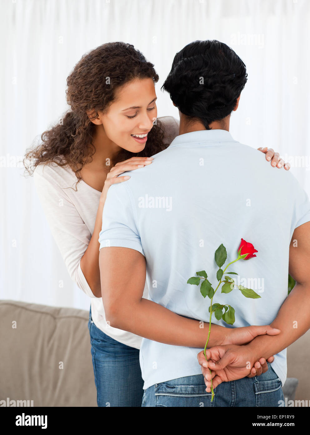 Beautiful woman finding rose hidden hi-res stock photography and images ...