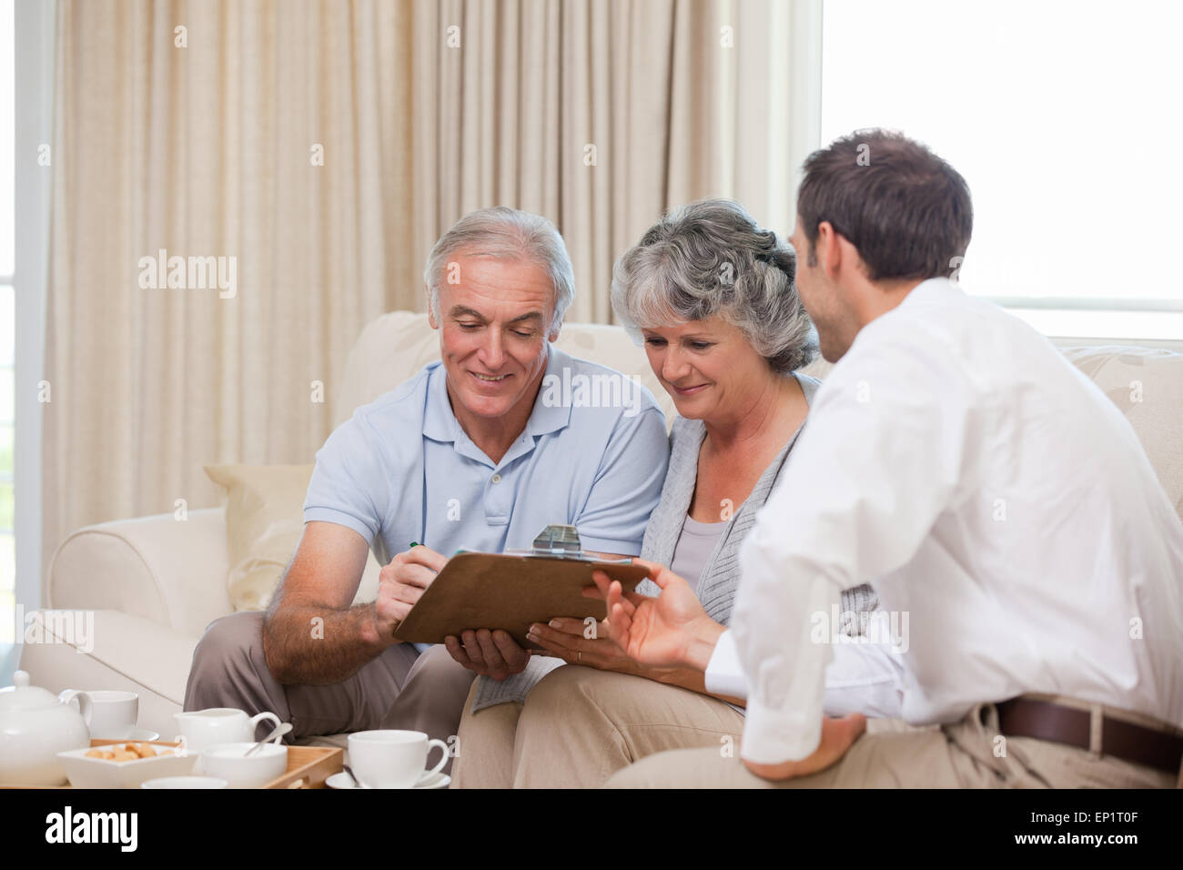 Seniors with assurance man Stock Photo - Alamy