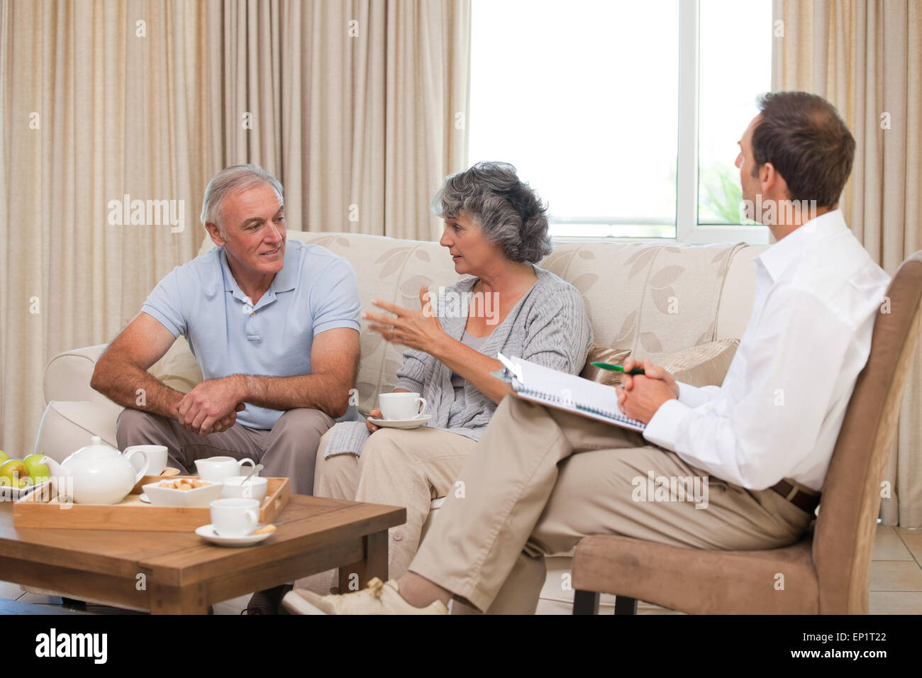 Seniors with assurance man Stock Photo - Alamy