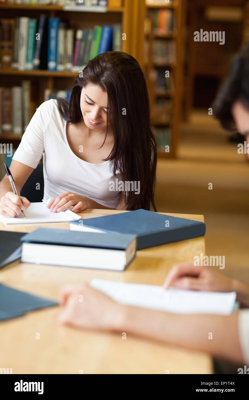 Portrait of a student writing a paper Stock Photo - Alamy