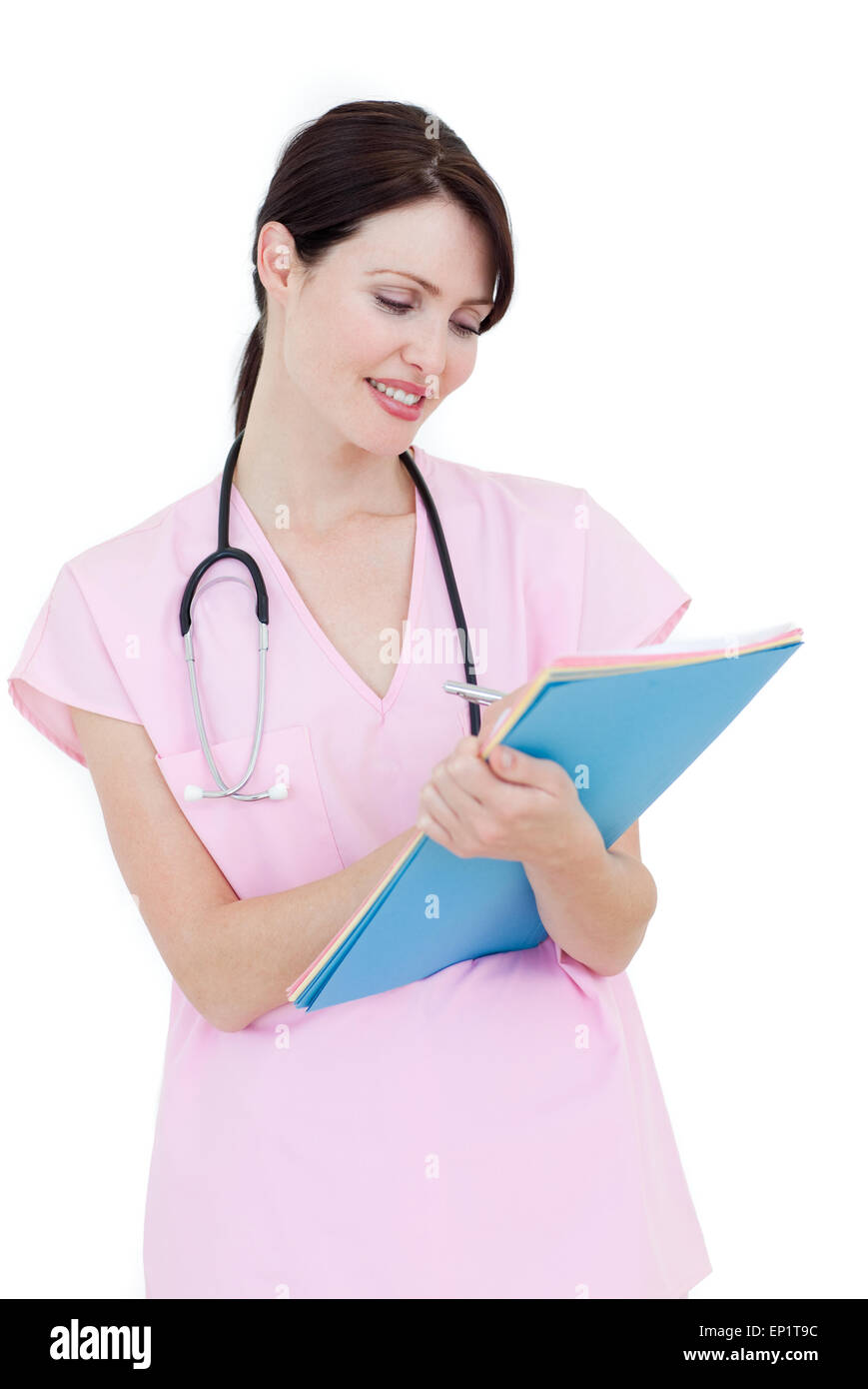 Serious young nurse taking notes isolated on a white background Stock ...