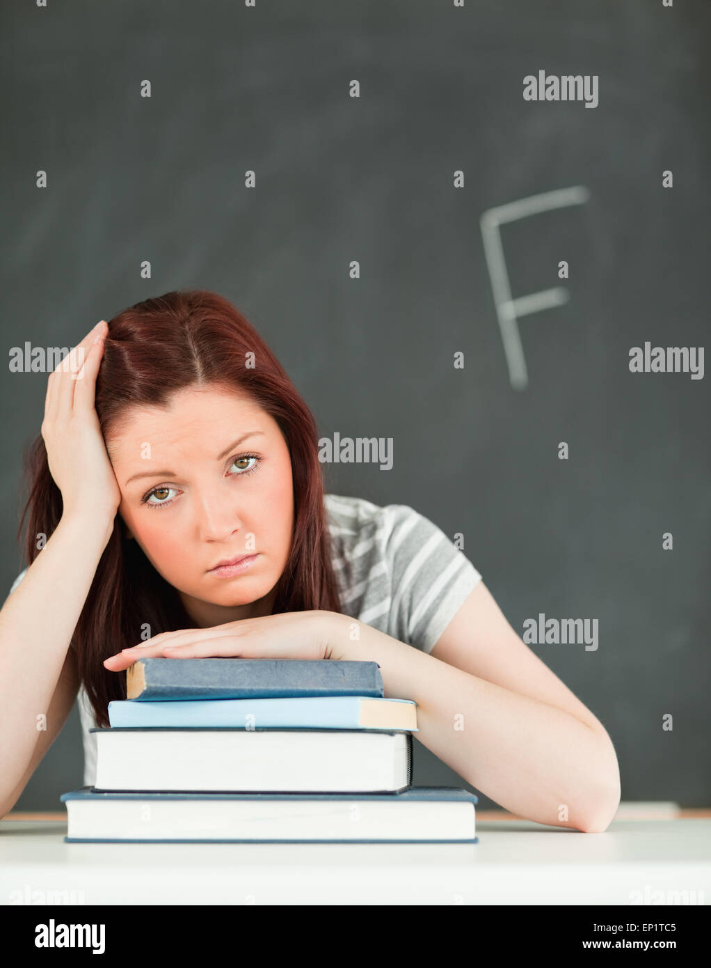 Portrait of a sad young woman receiving a bad mark Stock Photo - Alamy