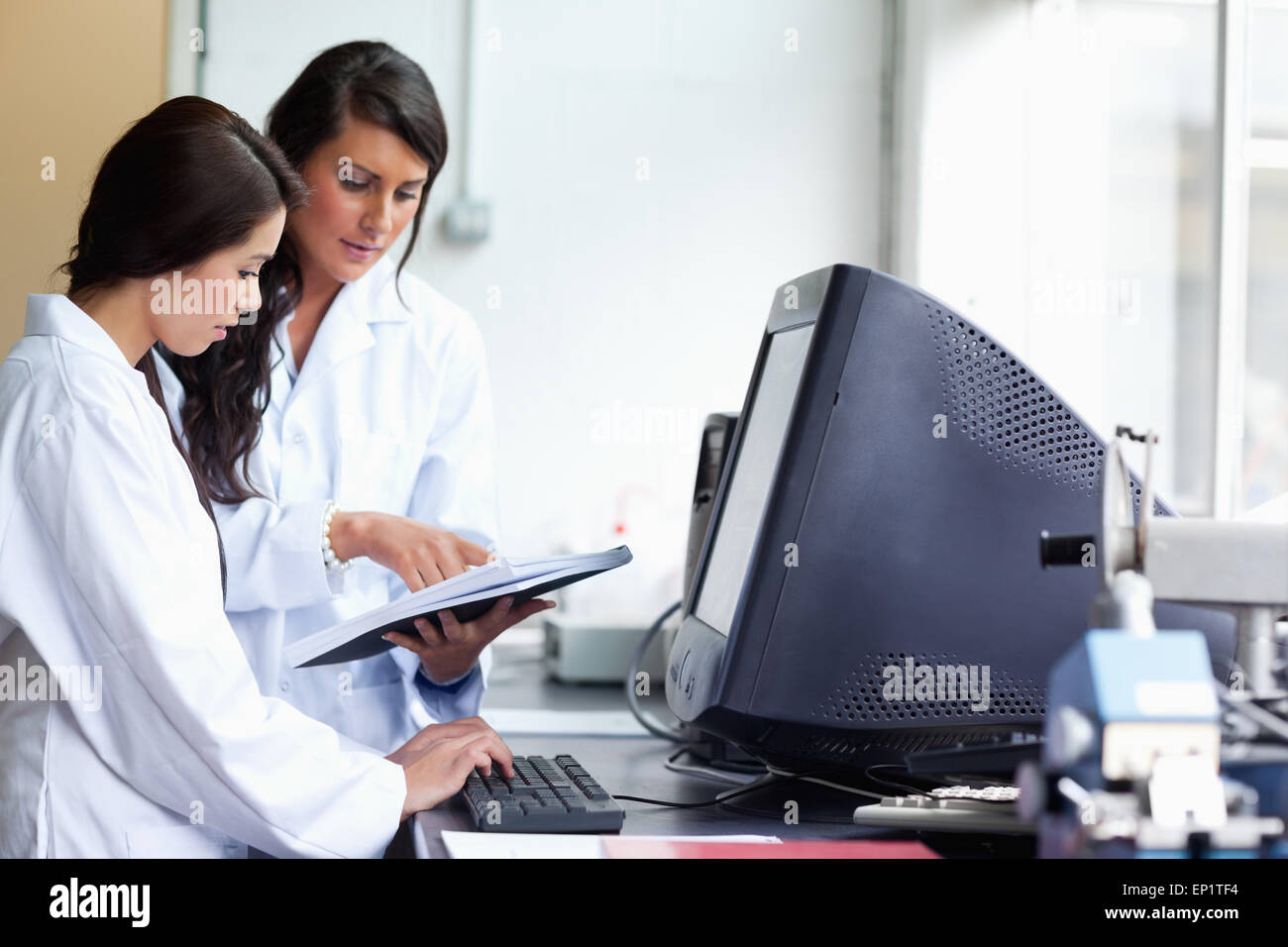 Female scientists comparing results Stock Photo - Alamy Female scientists comparing results Stock Photo - Alamy