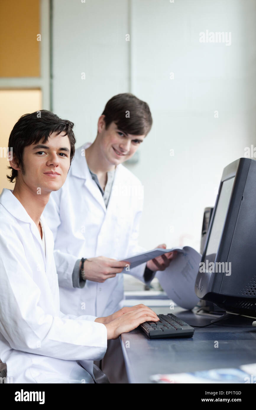 Portrait of male scientists with a monitor Stock Photo - Alamy