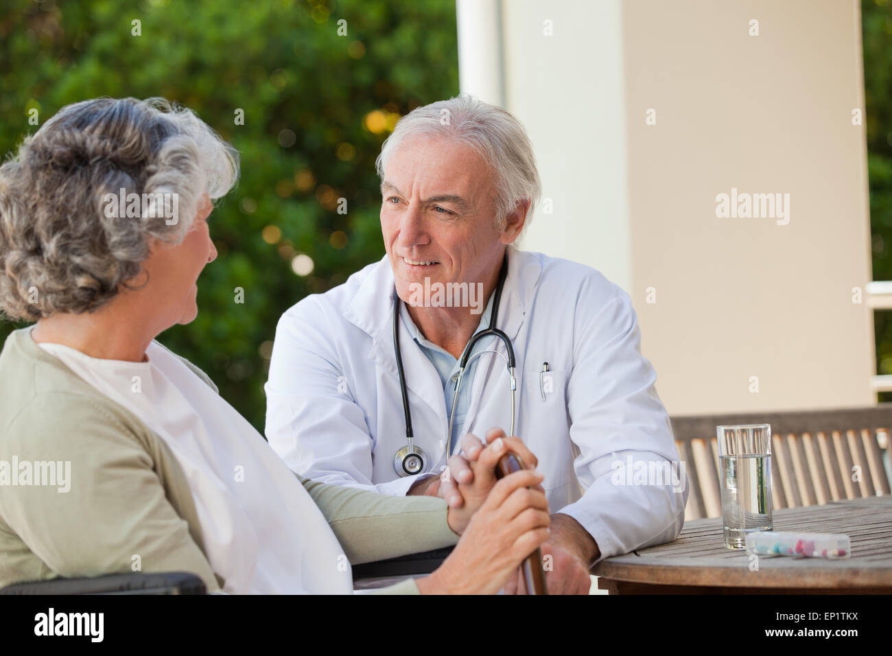 Senior doctor talking with his mature patient Stock Photo - Alamy