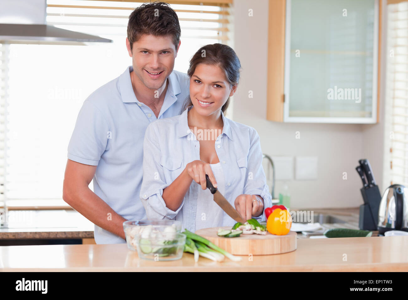 Couple cooking together Stock Photo - Alamy