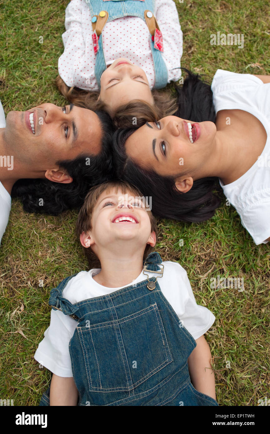Mom children lying on grass hi-res stock photography and images - Alamy