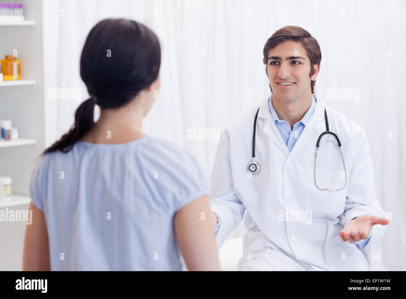 Physician having a conversation with patient Stock Photo - Alamy