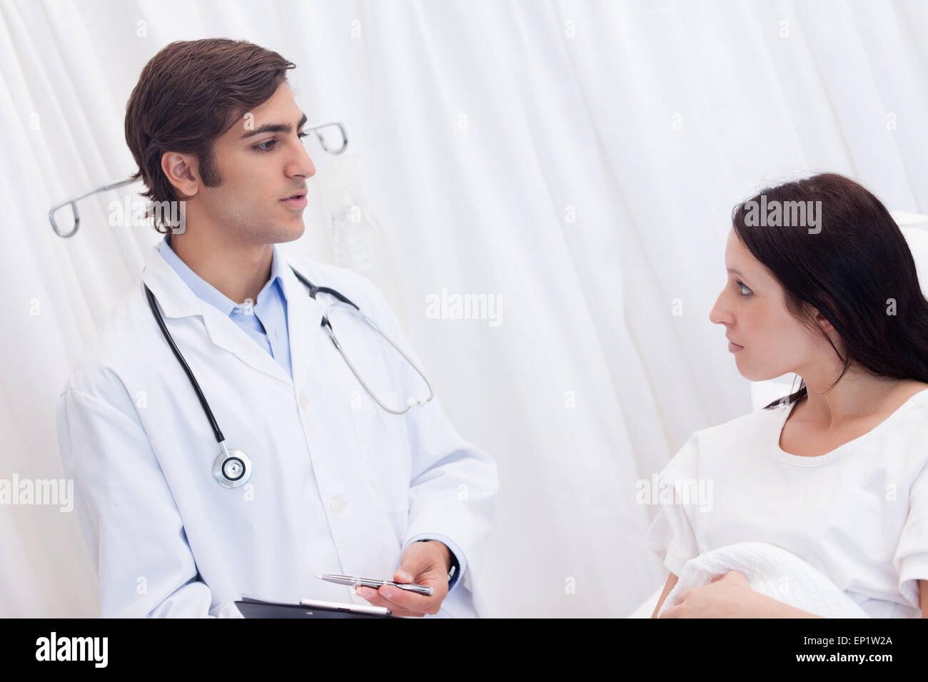 Patient getting examination results explained by doctor Stock Photo - Alamy