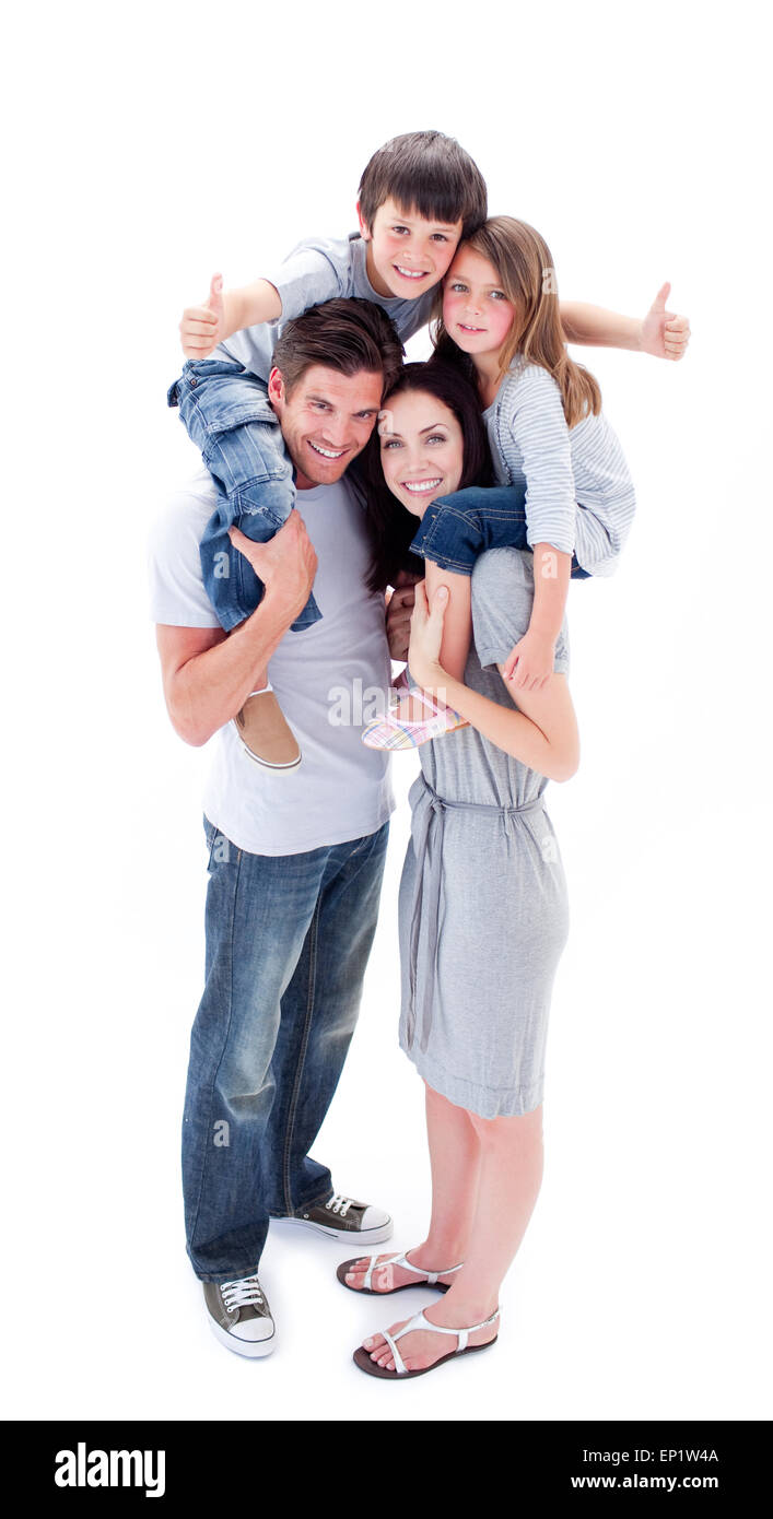 Jolly parents giving their children piggyback ride Stock Photo - Alamy