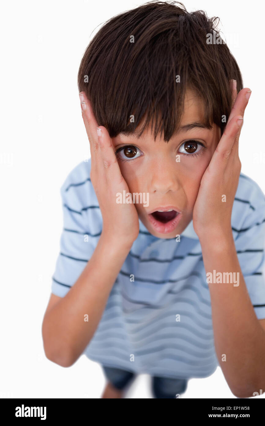 Portrait of a shocked boy looking at the camera Stock Photo - Alamy
